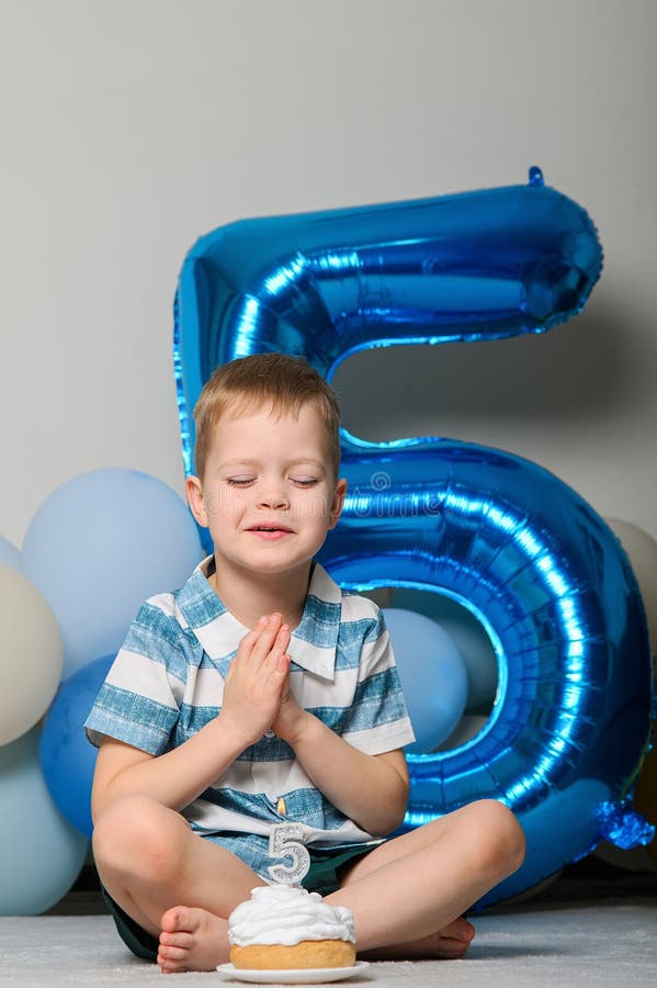 Happy Five Year Old Boy Celebrating Birthday with Cupcake and Candle ...