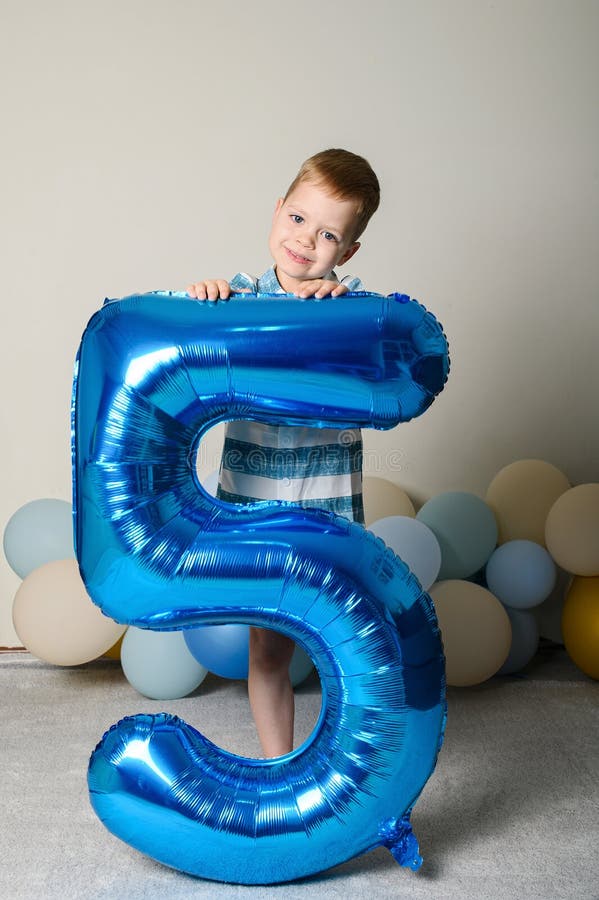 Happy Five Year Old Boy with Number Five Balloon Stock Photo - Image of ...