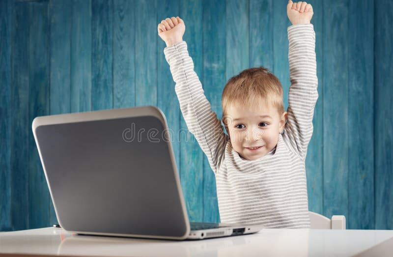 Happy Five Years Old Child Sitting with a Laptop at Table Stock Image ...