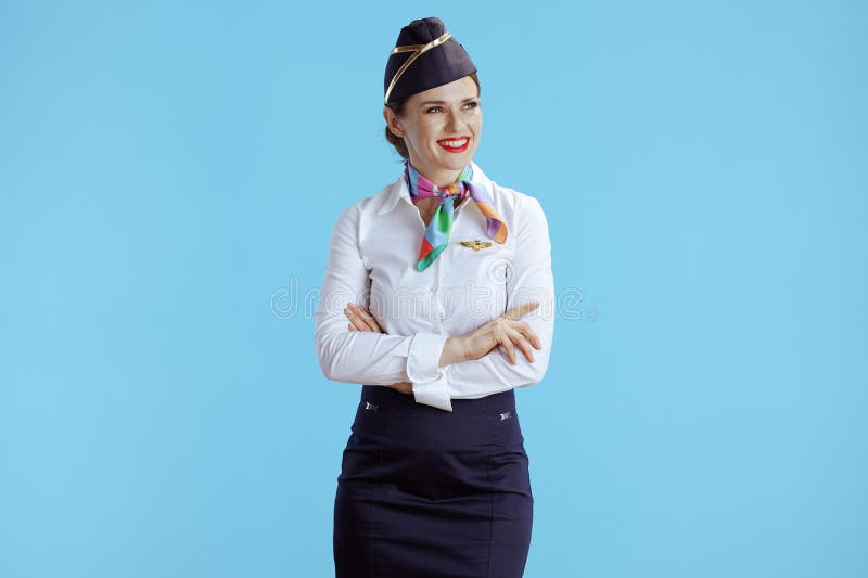 Happy Flight Attendant Woman on Blue Looking at Copy Space Stock Image ...