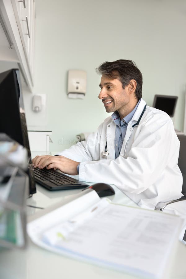 Happy Focused Middle Aged Practitioner Doctor Man Working Computer ...