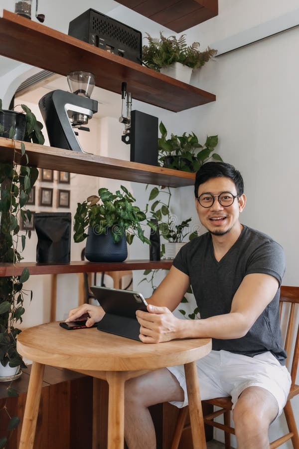 Happy Freelance Man Working in the Cafe with His Tablet. Stock Photo ...