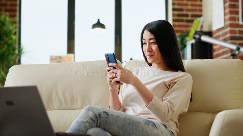 Happy Freelancer Answering Client Email on Smartphone while Working ...