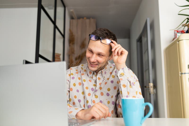 Happy Freelancer in Glasses Using Laptop, Writing Email or Message ...