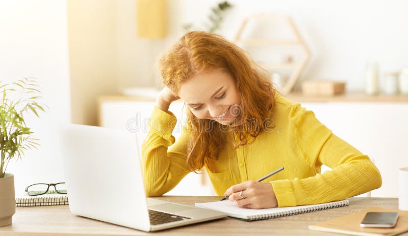Happy Freelancer Woman Making Her Schedule and Taking Notes Stock Photo ...