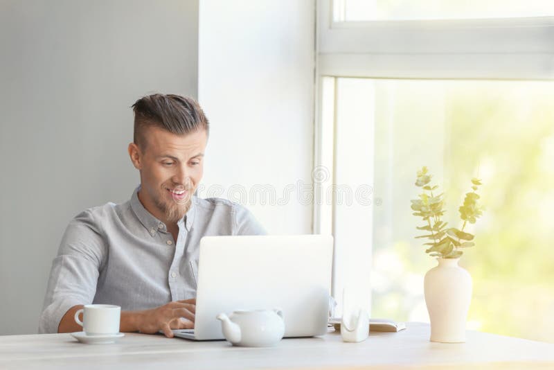 Happy Freelancer Working on Laptop in Cafe Stock Photo - Image of ...