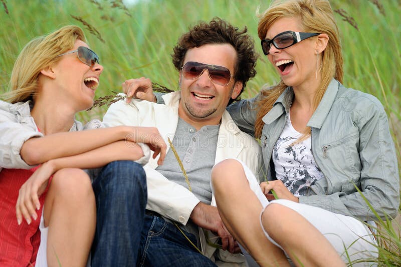 Three Friends Having Fun at Beach Stock Image - Image of clothing ...