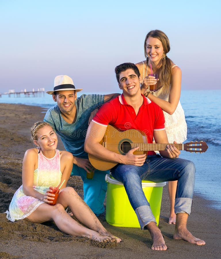 Happy Friends at the Beach Looking at the Camera Stock Photo - Image of ...