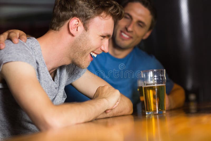 Happy Friends Catching Up Over Pints Stock Image - Image of smiling ...