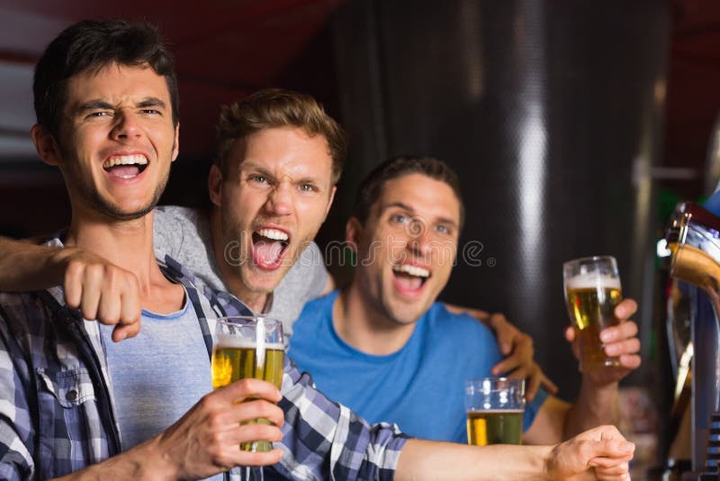 Happy Friends Catching Up Over Pints Stock Image - Image of together ...