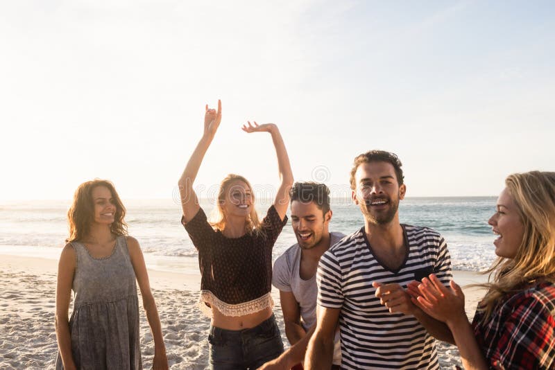 Happy Friends Dancing Together Stock Photo - Image of amusement, ocean ...