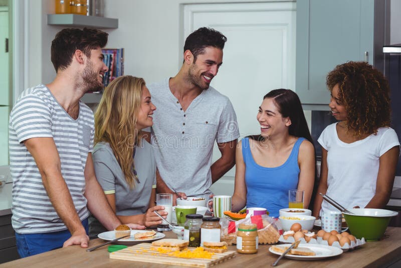Happy Friends Discussing while Having Breakfast Stock Image - Image of ...