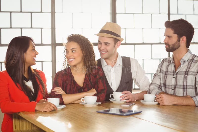Happy Friends Discussing Together Stock Photo - Image of cafeteria ...