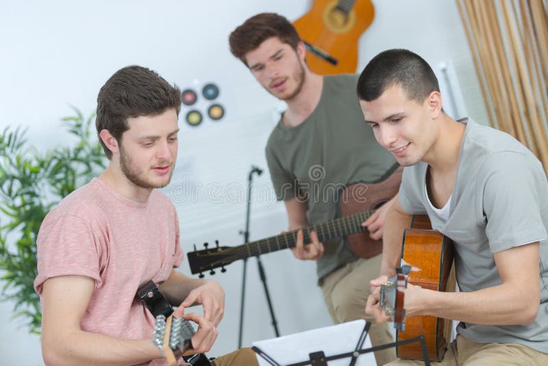 Happy Friends Doing Guitar Trio Stock Image - Image of guitar, family ...