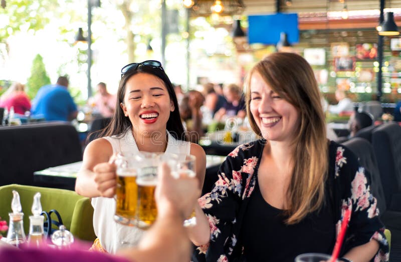 Friends Drinking Beer in the Bar Stock Photo - Image of hand, face ...