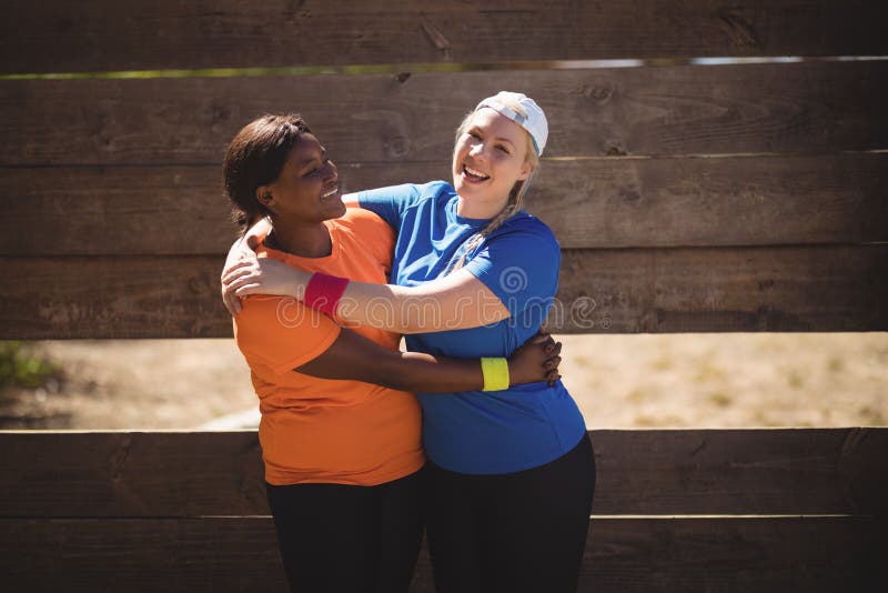 Happy Friends Embracing Each Other during Obstacle Course Stock Image ...