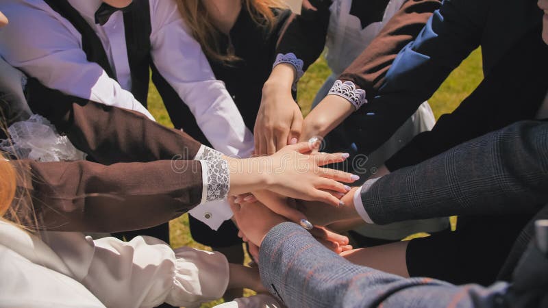Happy Friends Graduates Join Hands Together. the Concept of a Friendly ...