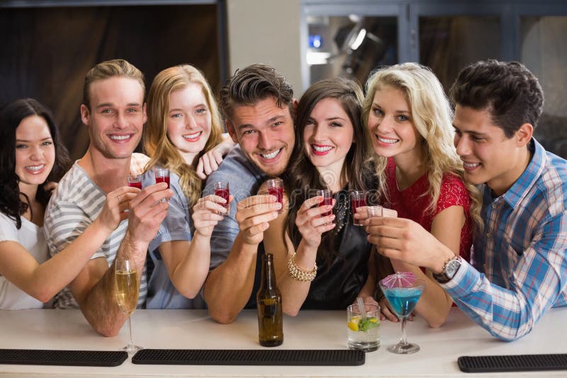 Happy Friends Having a Drink Together Stock Photo - Image of people ...