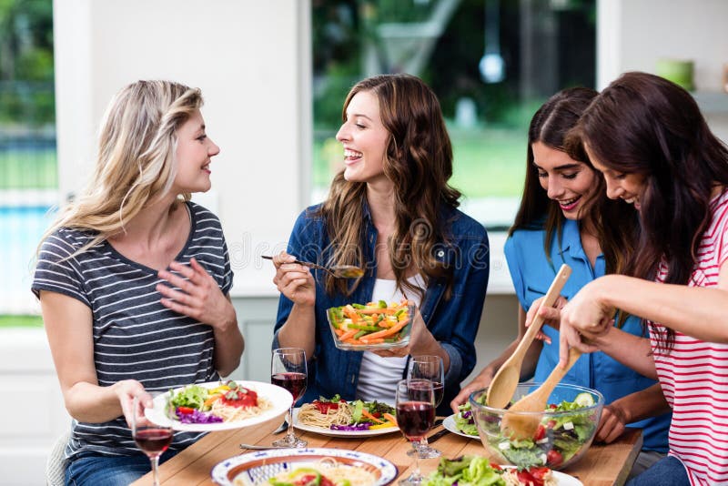 Happy friends having food stock photo. Image of bowl - 68181058
