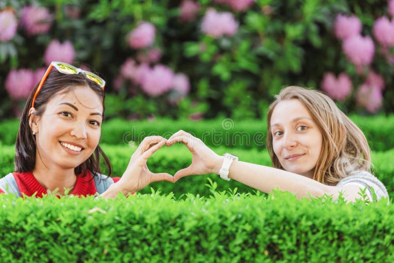 Friends Having Fun in Blooming Park at Spring Stock Photo - Image of ...
