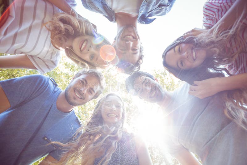 Happy Friends Huddling in Circle in the Park Stock Image - Image of ...