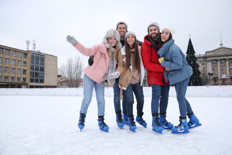 Happy Friends at Ice Skating Rink Outdoors Stock Photo - Image of ...
