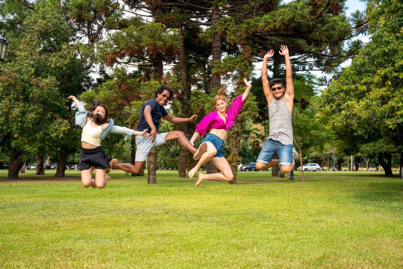 Happy Friends Jumping in the Park Stock Image - Image of meet, friends ...