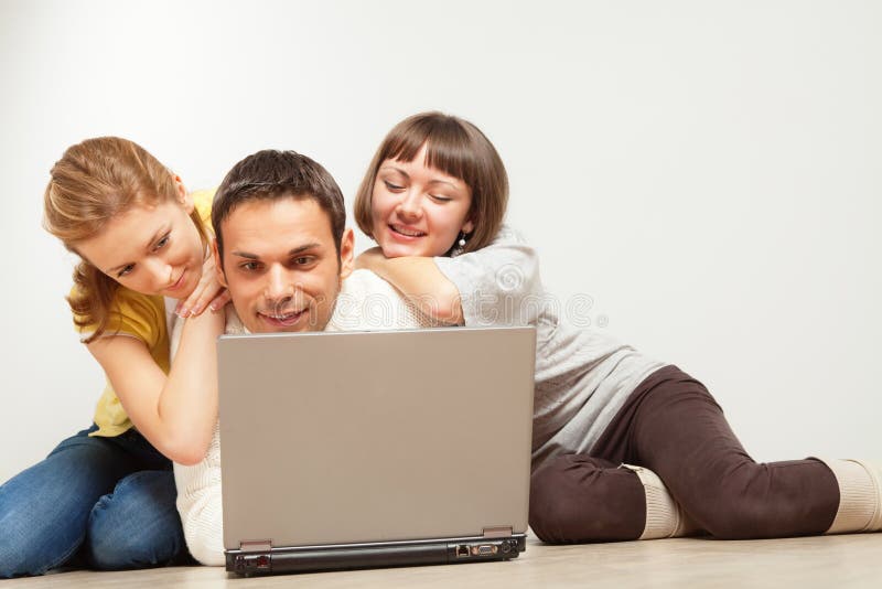 Happy Friends with Laptop Computer Stock Photo - Image of person, floor ...
