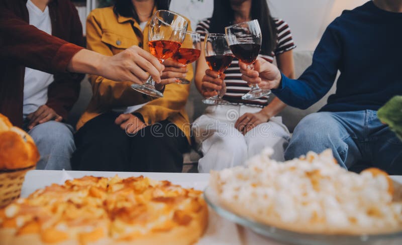 Happy Friends Making a Toast with Beer before Eating Pizza in a Shared ...