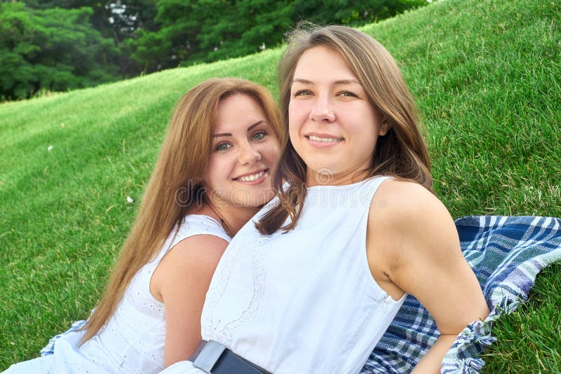 Happy friends in the park stock photo. Image of leisure - 75208868