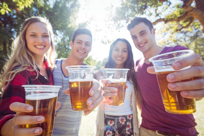 Happy Friends in the Park Having Beers Stock Image - Image of caucasian ...