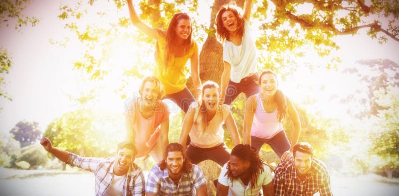 Happy Friends in the Park Making Human Pyramid Stock Photo - Image of ...