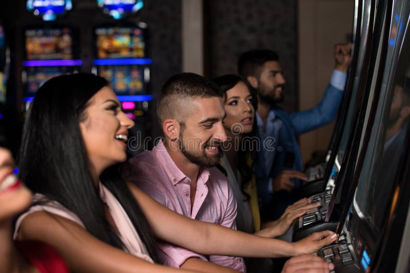 Happy Man Playing Arcade Machine in a Casino Stock Image - Image of ...