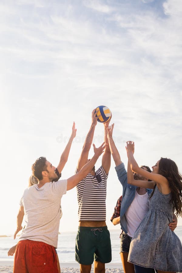 Happy Friends Playing Beach Volleyball Stock Image - Image of casual ...