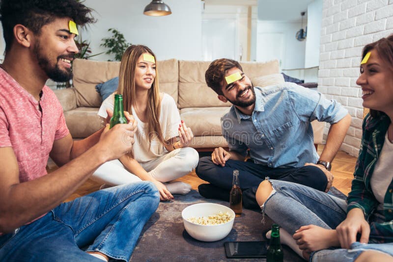Happy Friends Playing Game Guess Who and Having Fun Stock Photo - Image ...