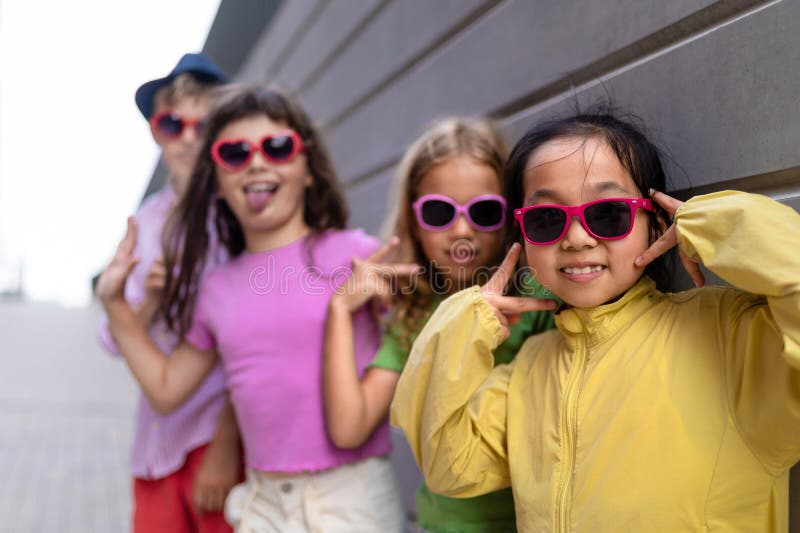 Happy Friends Posing Together in City, Standing in Front of Concrete ...