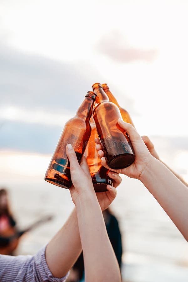 Happy Friends Raise Brown Beer Bottles Stock Photo - Image of rest ...