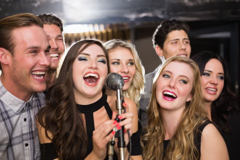 Happy Friends Singing Karaoke Together Stock Photo - Image of party ...
