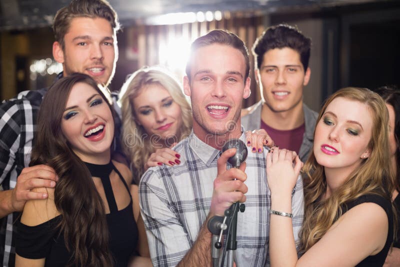 Happy Friends Singing Karaoke Together Stock Image - Image of ...