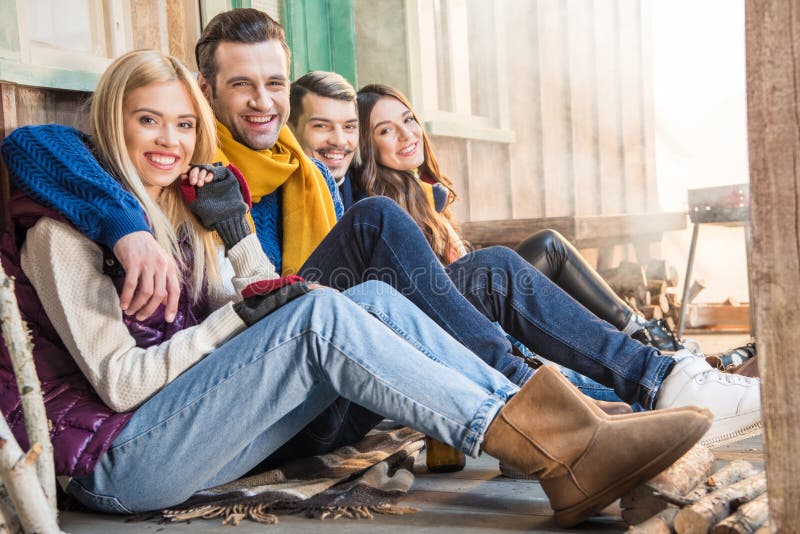 Happy Friends Sitting Together and Looking To Camera Stock Photo ...