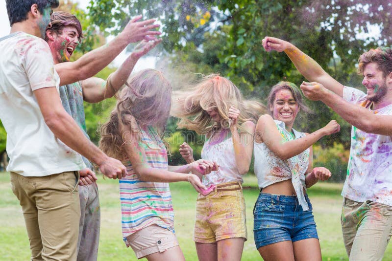 Happy Friends Throwing Powder Paint Stock Image - Image of girl ...