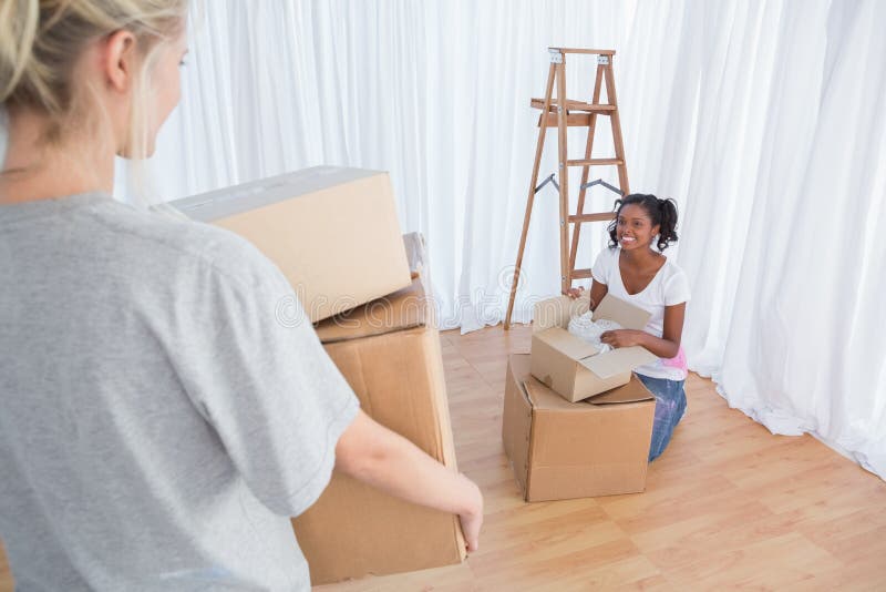 Happy Friends Unpacking in Their New Home Stock Image - Image of ...