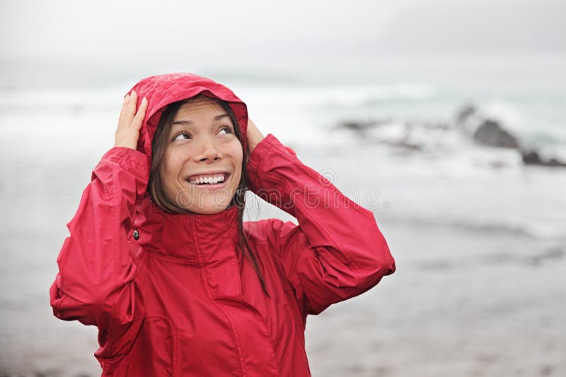 Happy Fun Girl Enjoying Rain on Beach Stock Photo - Image of raincoat ...