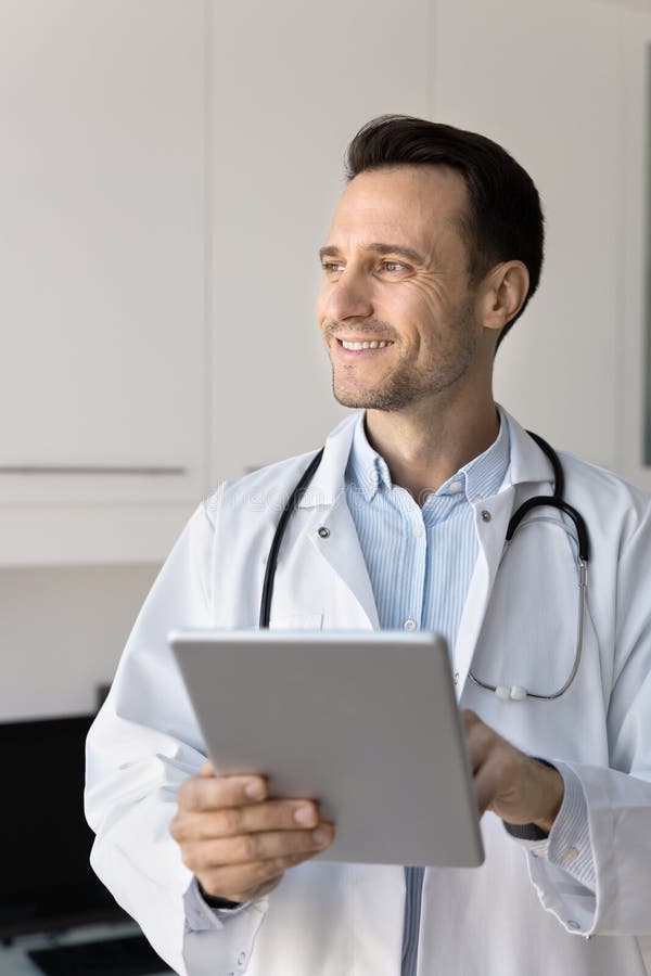 Happy General Practitioner Doctor Using Medical Application on Tablet ...
