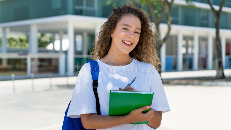 Happy German Female Student with Backpack and Paperwork Stock Photo ...