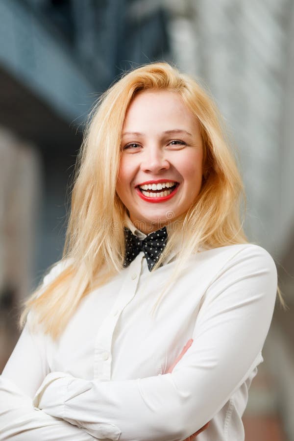 Happy Ginger with Red Lips Laughing in Lobby of Building Stock Image ...