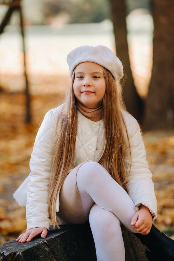 A Happy Girl in a Cap Walking in the Autumn Park Stock Photo - Image of ...