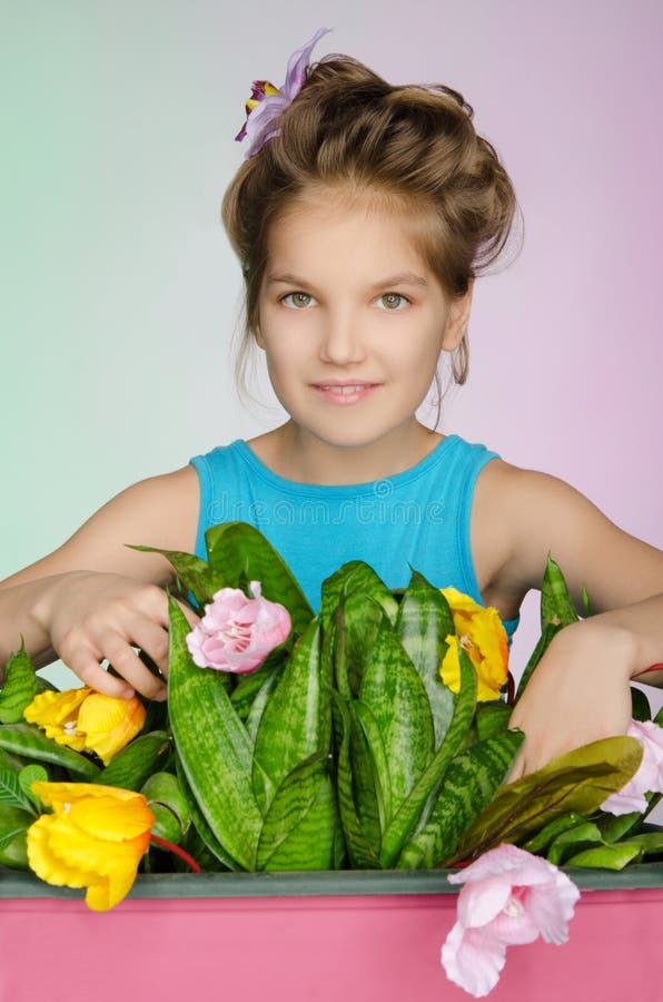 Happy Girl is Caring for Flowers Stock Photo - Image of blue, coloured ...