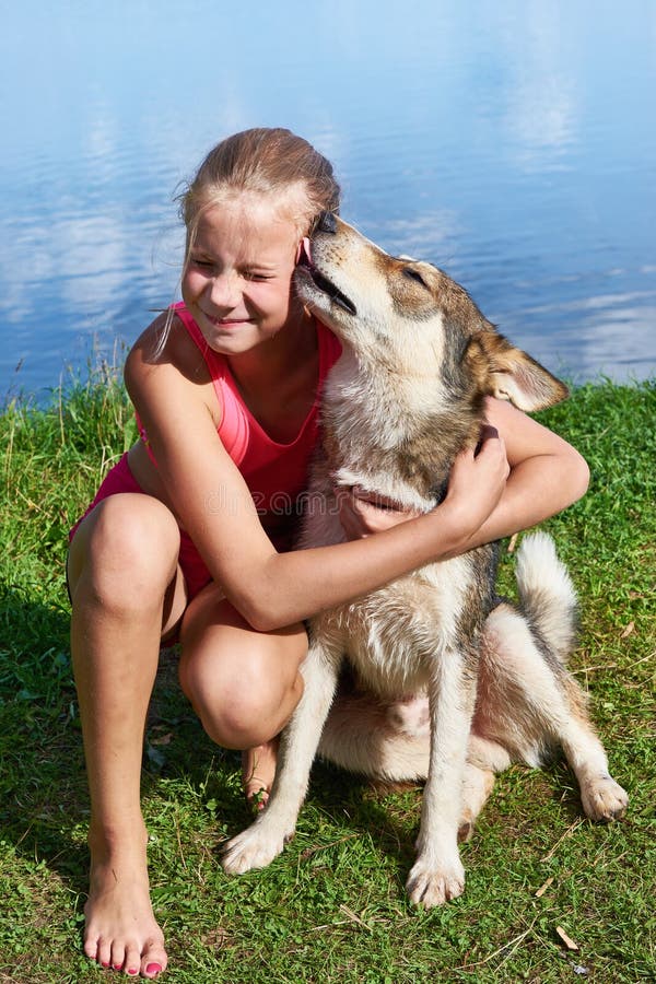Happy girl with dog stock image. Image of loving, happiness - 75077951