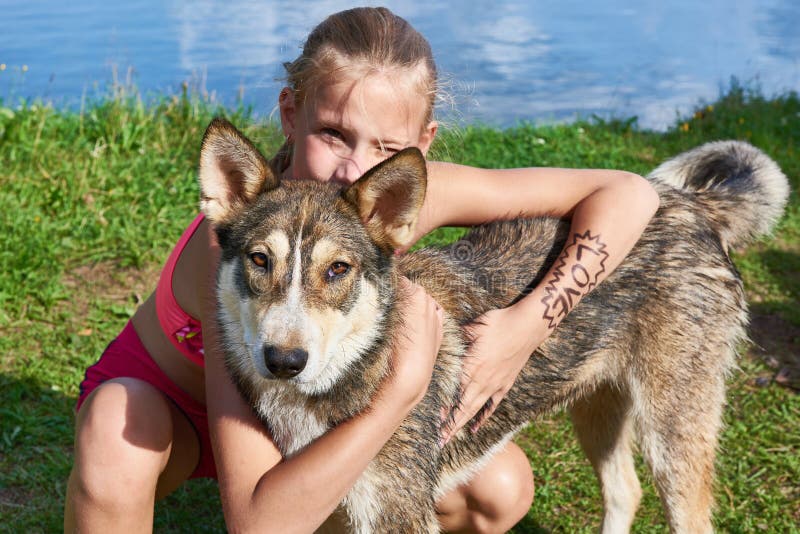 Happy girl with dog stock photo. Image of animals, person - 75077986